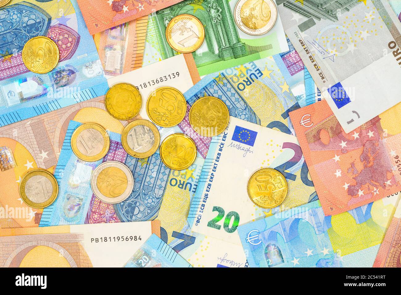 Euro banknotes and coins of different value. Mixed Euro currency money ...