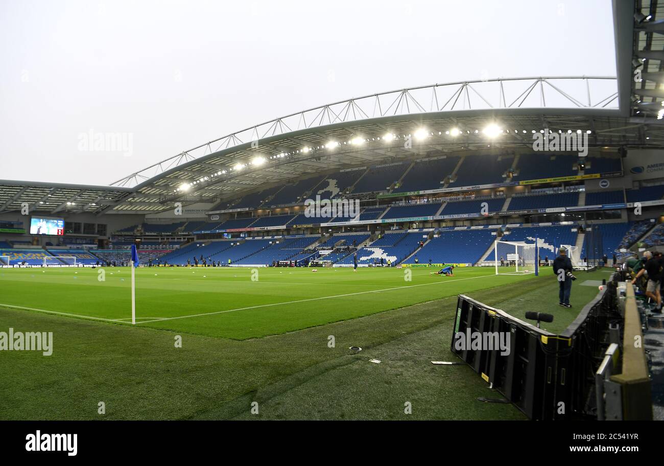 Players warm up in the empty stadium before the Premier League match at ...