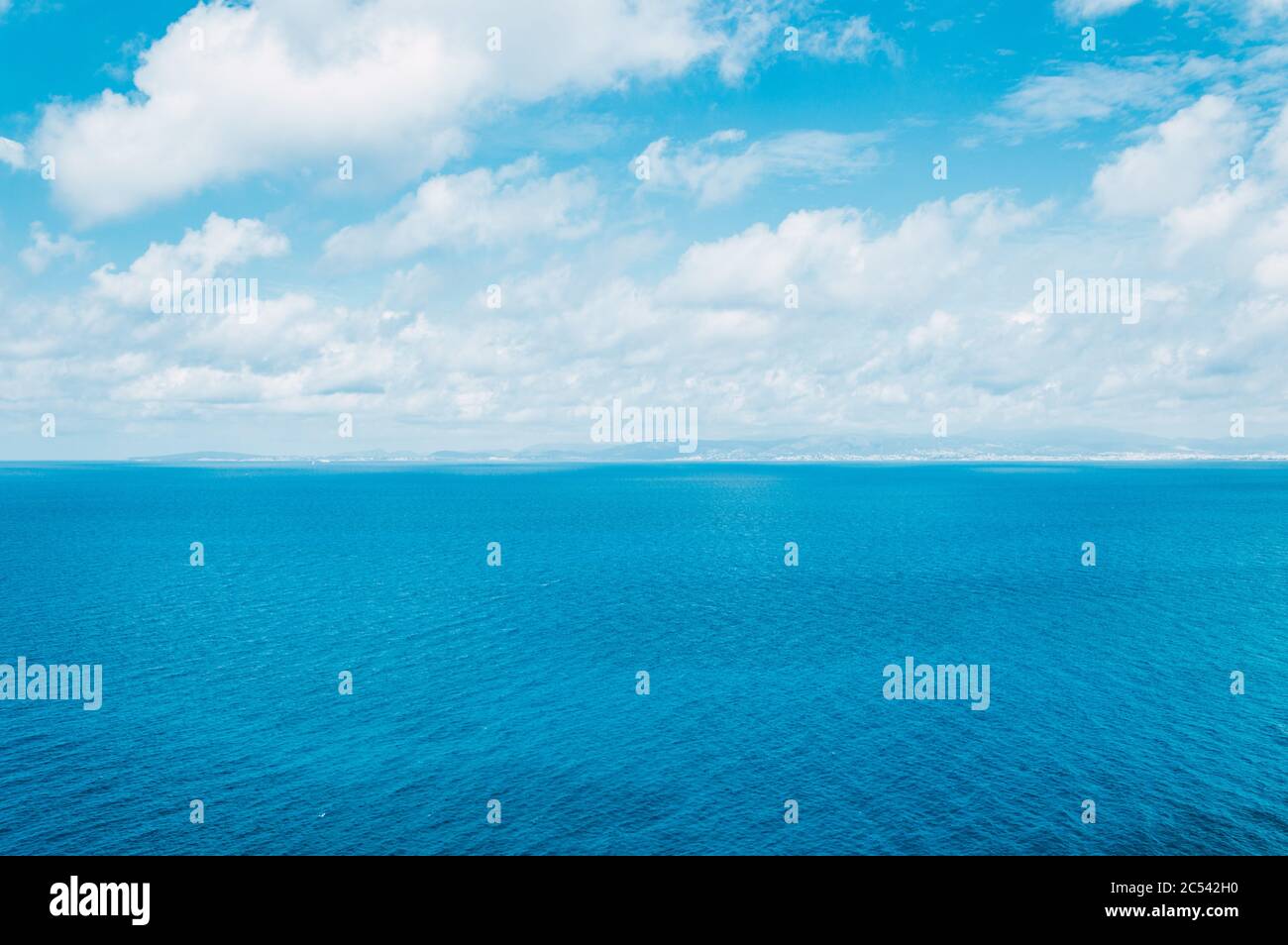 Beautiful cloudy sky over the blue sea for a background or wallpaper ...