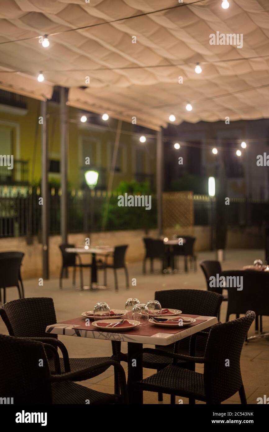Vertical shot of the tables and chairs of a restaurant Stock Photo - Alamy