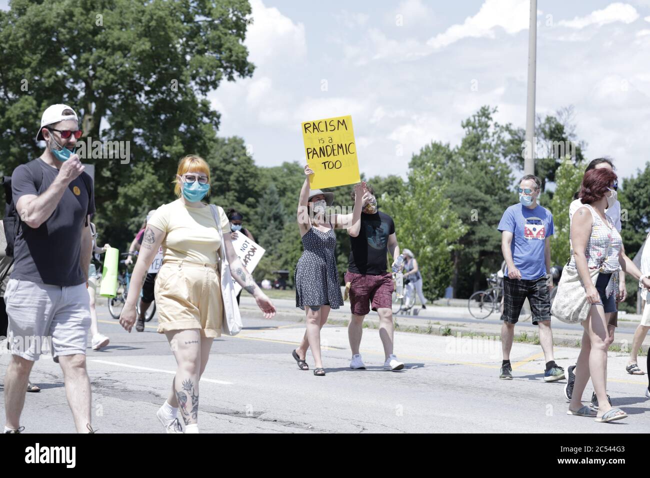 People march and hold up posters along the streets to support anti ...