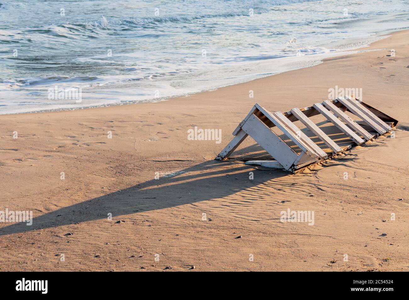 Broken sun bed on the seashore.The off-season Stock Photo - Alamy