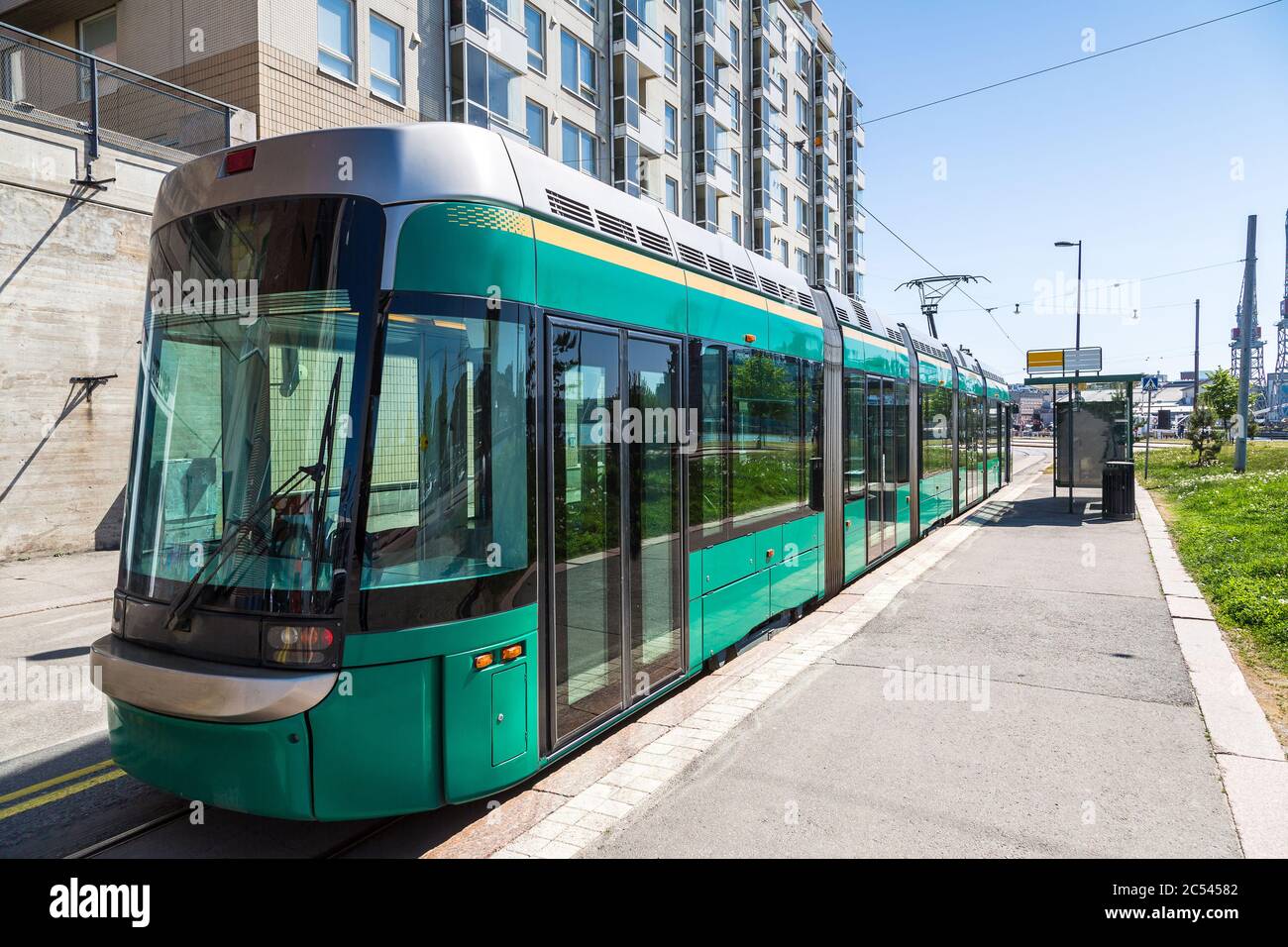 Public transport, modern tram in Helsinki in a beautiful summer day ...