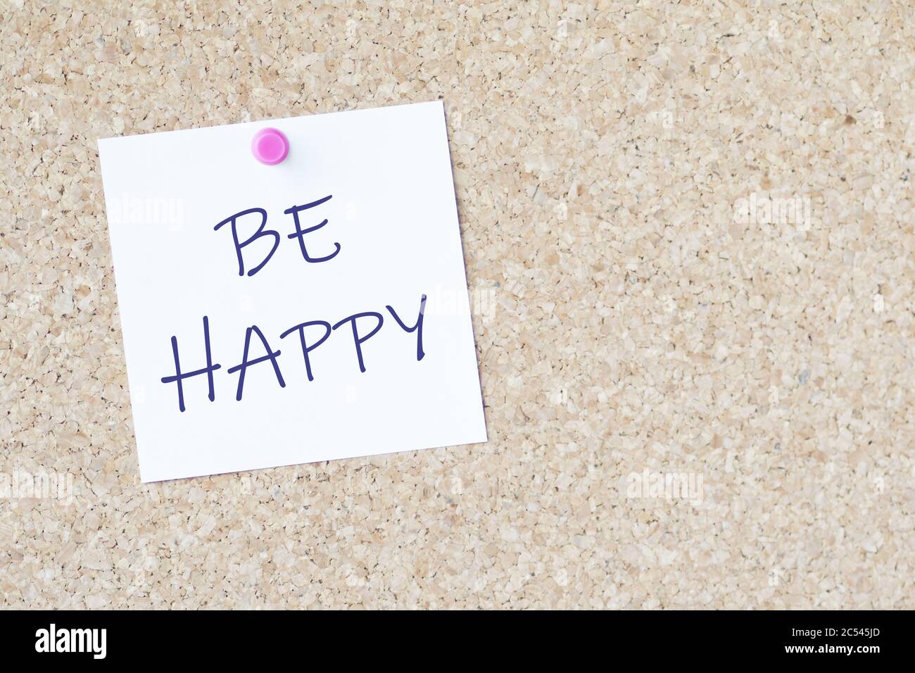 Words "be happy" on a paper attached to a board with a pin Stock Photo ...