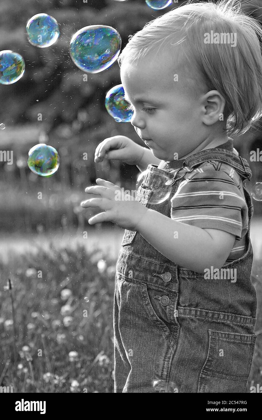 Little boy playing with bubbles Stock Photo - Alamy
