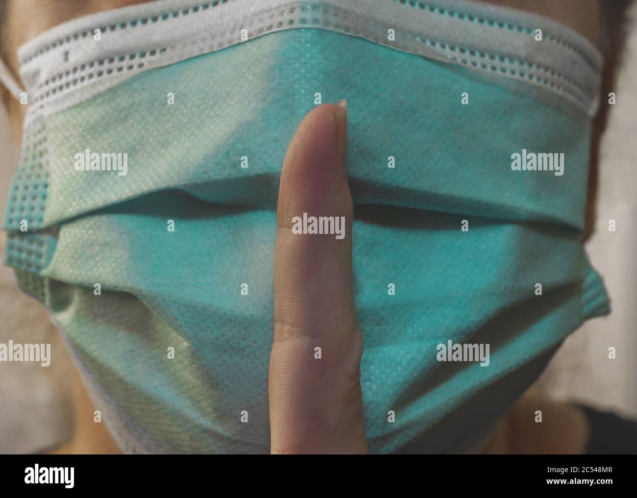 A closeup shot of a doctor wearing protection face mask- COVID-19 Stock ...