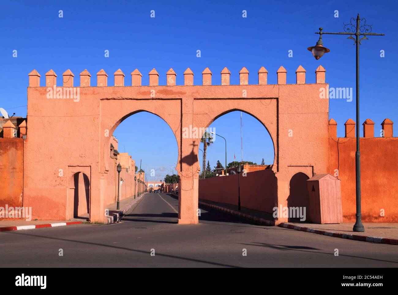 Morocco, Marrakesh. Medieval city wall and double arched city gates ...