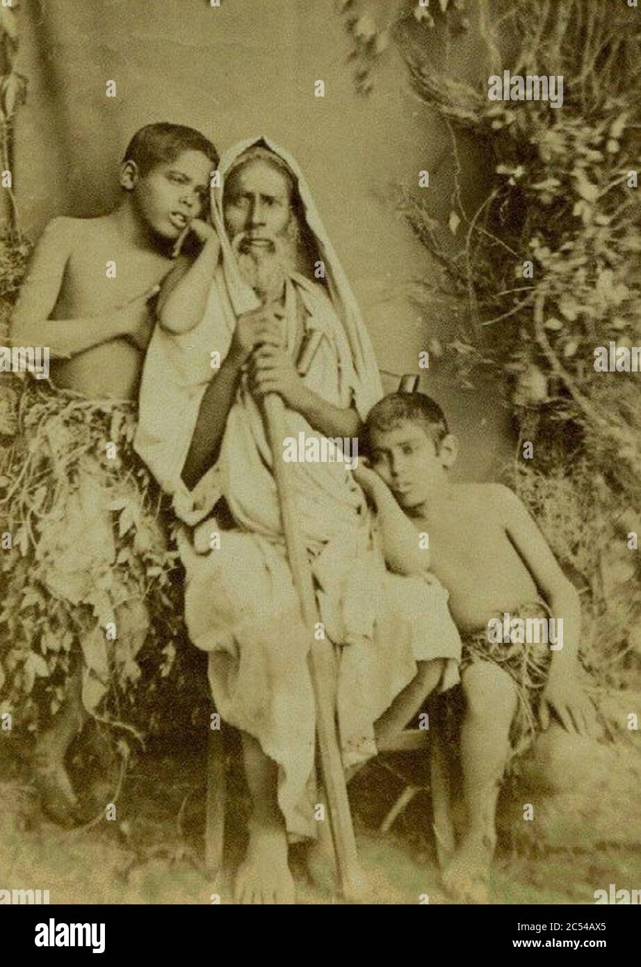 Indian holy Man with two boys in the 19th century Stock Photo - Alamy