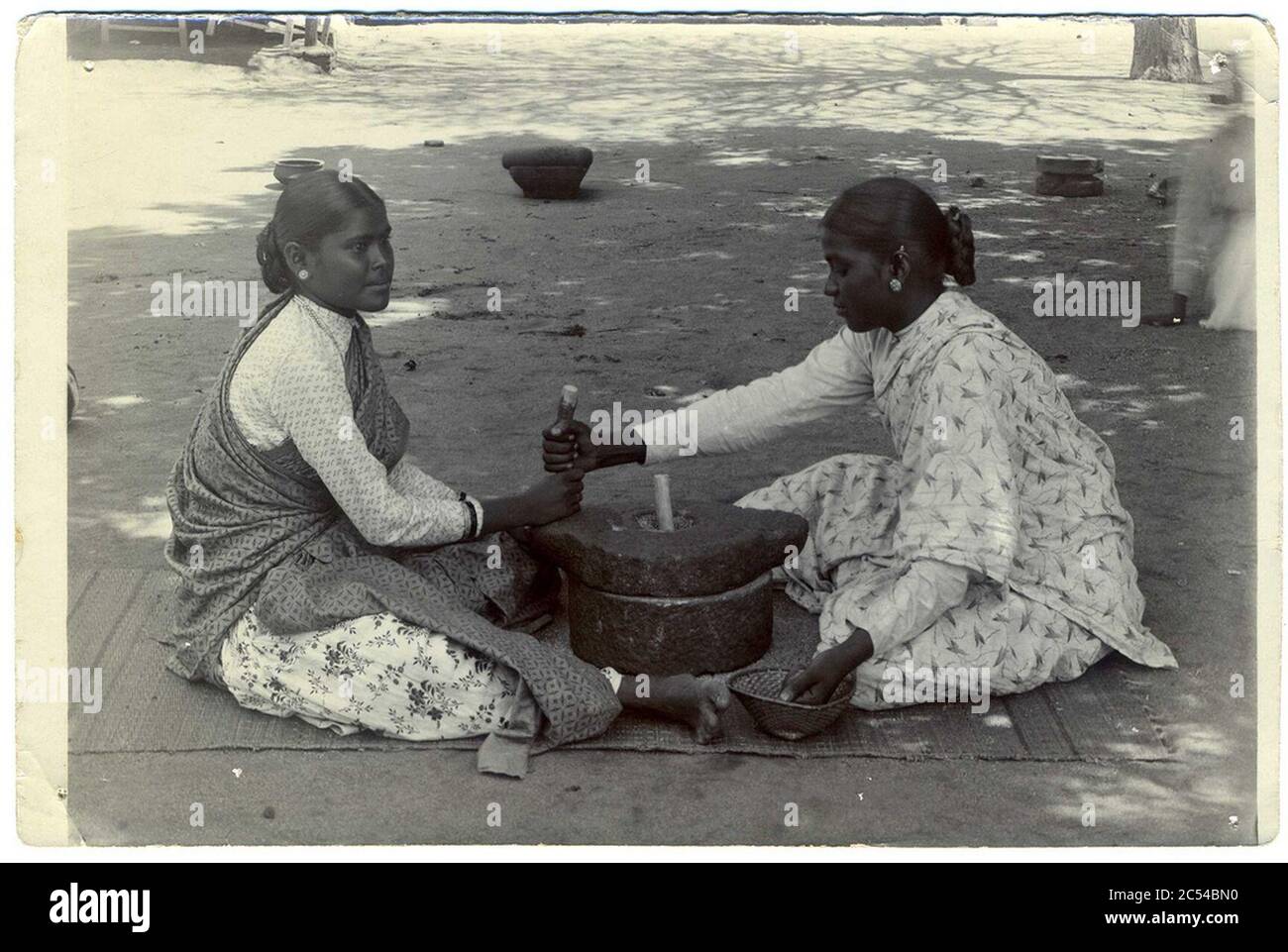 Women grinding hi-res stock photography and images - Alamy