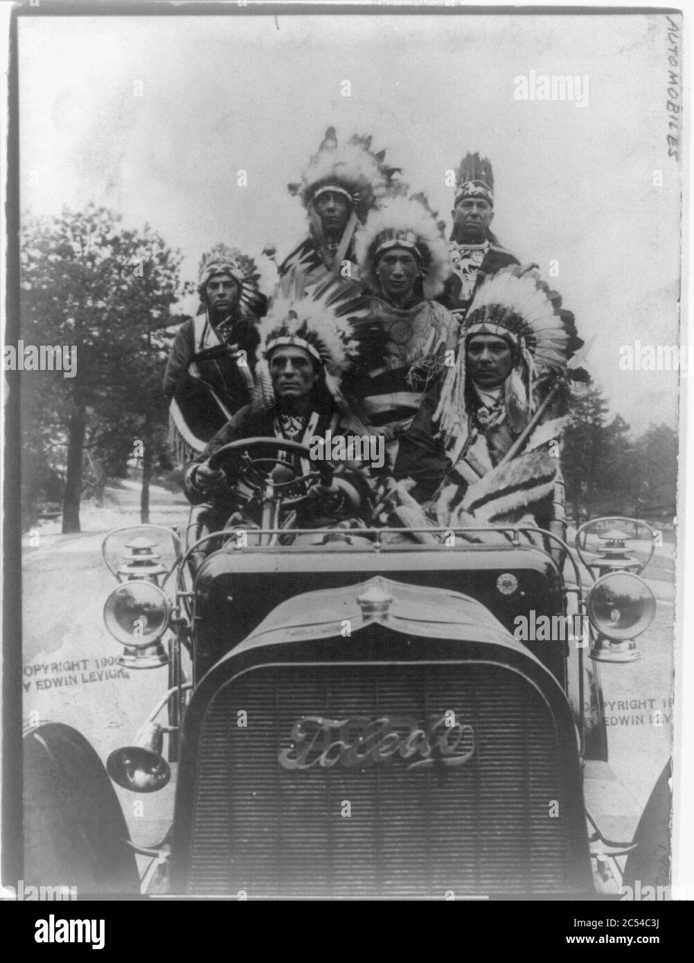 Indians posed in automobile Stock Photo - Alamy