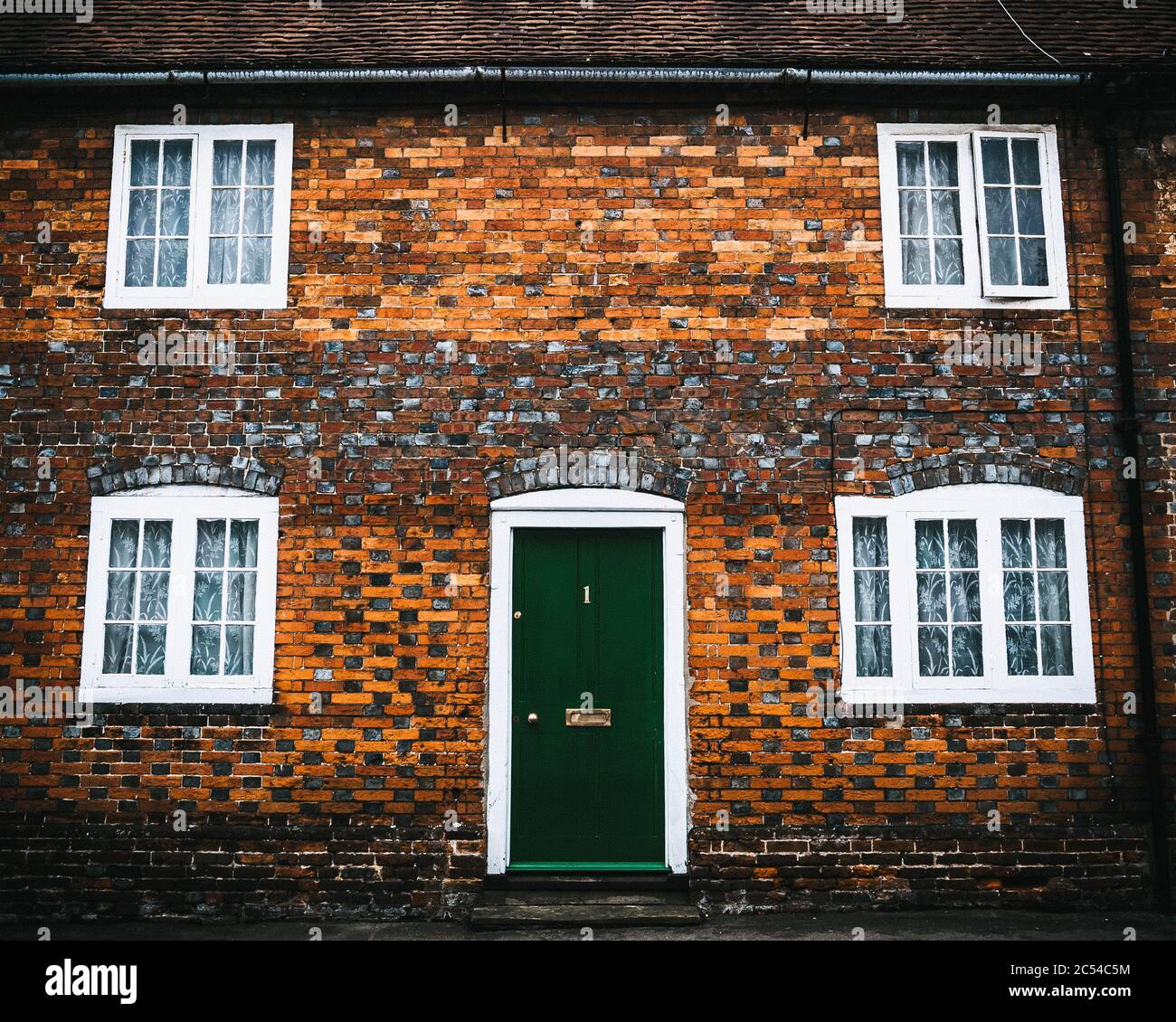 Facade of a traditional English brick home in the village of Wickham ...