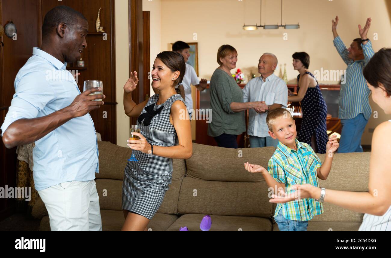Large family with grandparents and children dancing at home Stock Photo ...