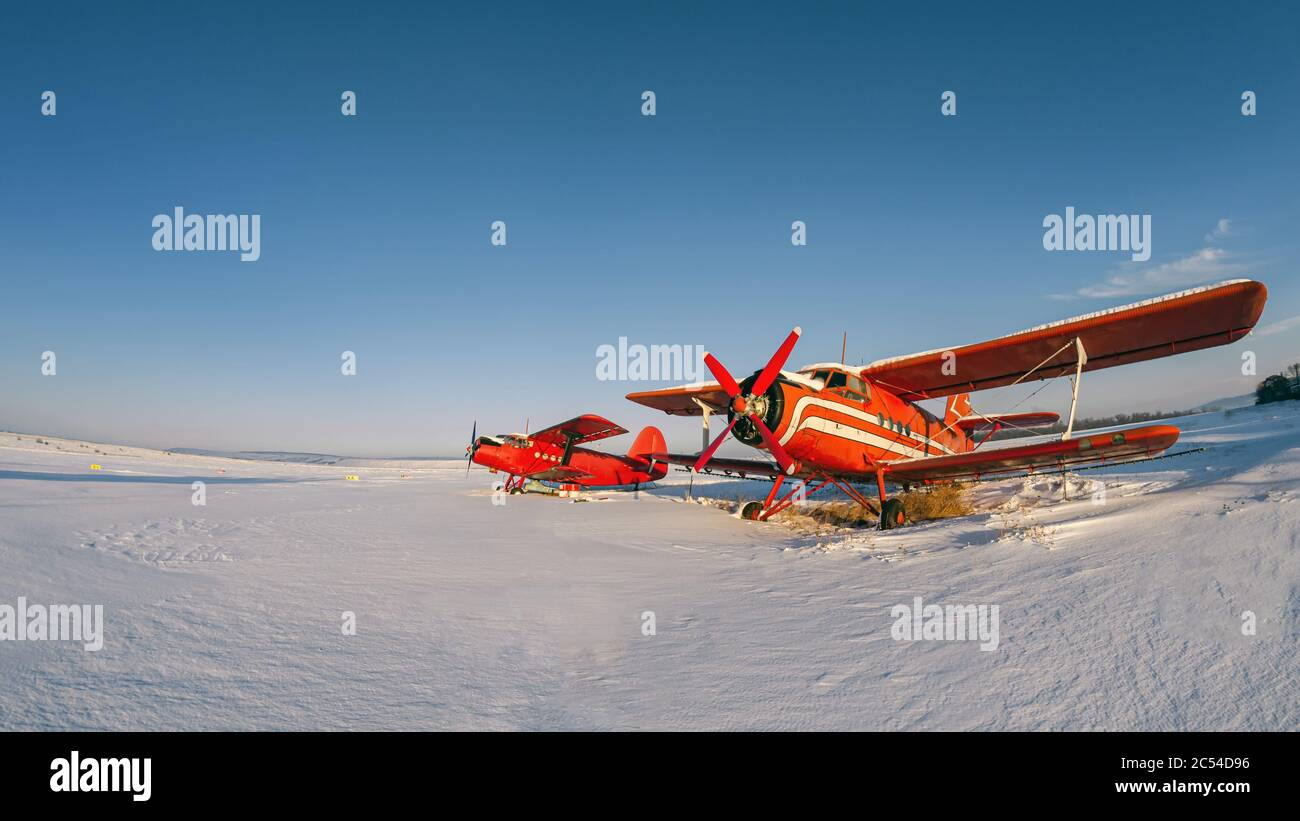 Old classic airplane on snow covered airfield. Abandoned vintage ...