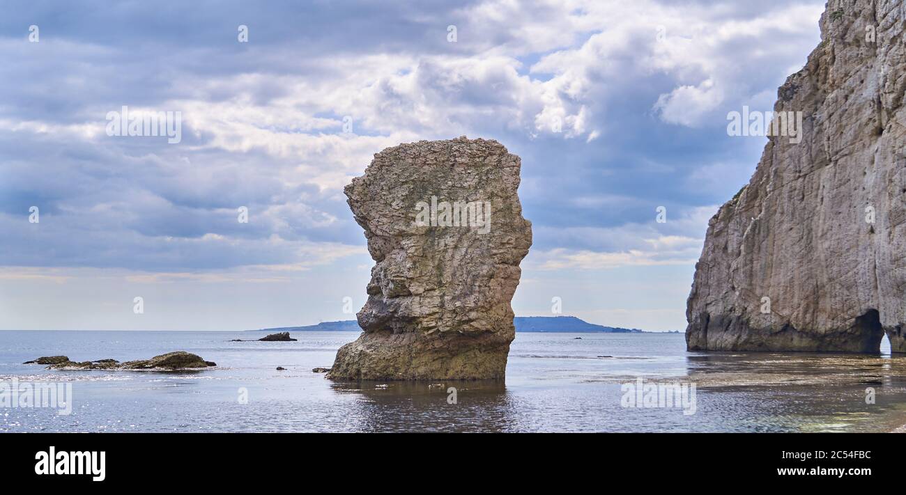 Butter Rock and Bat's Head under blue sky and white clouds Stock Photo ...