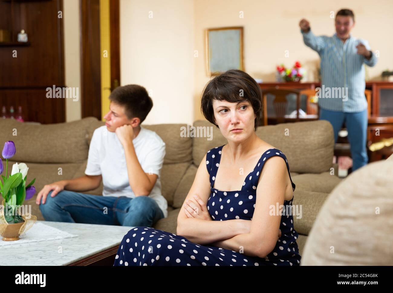 Parents quarrel with teenage son Stock Photo - Alamy