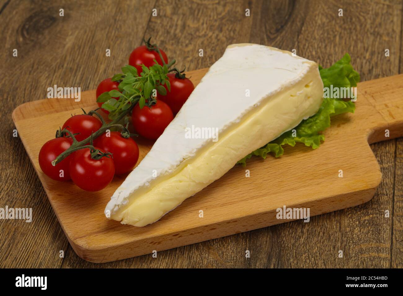 Brie cheese triangle served salad leaves Stock Photo - Alamy