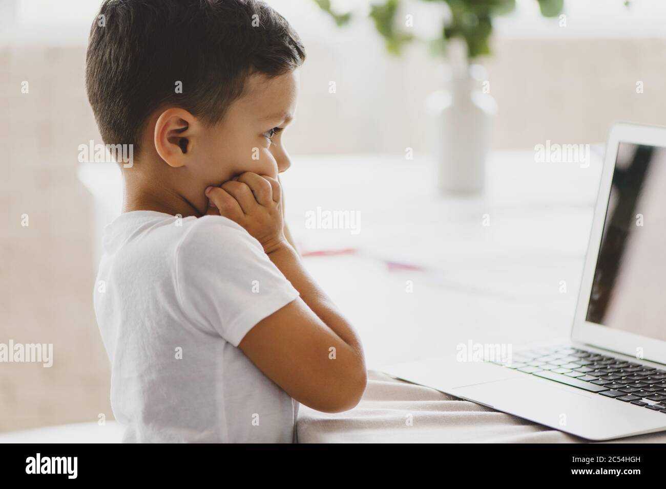 Boy typing laptop hi-res stock photography and images - Alamy