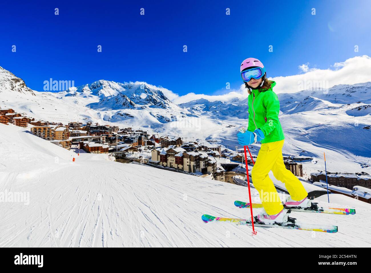Happy young girl enjoying winter vacations in mountains, Val Thorens, 3 ...