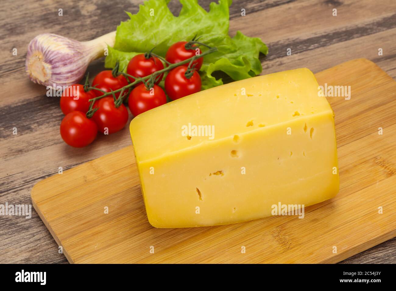 Swiss Hard yellow tasty cheese brick Stock Photo - Alamy