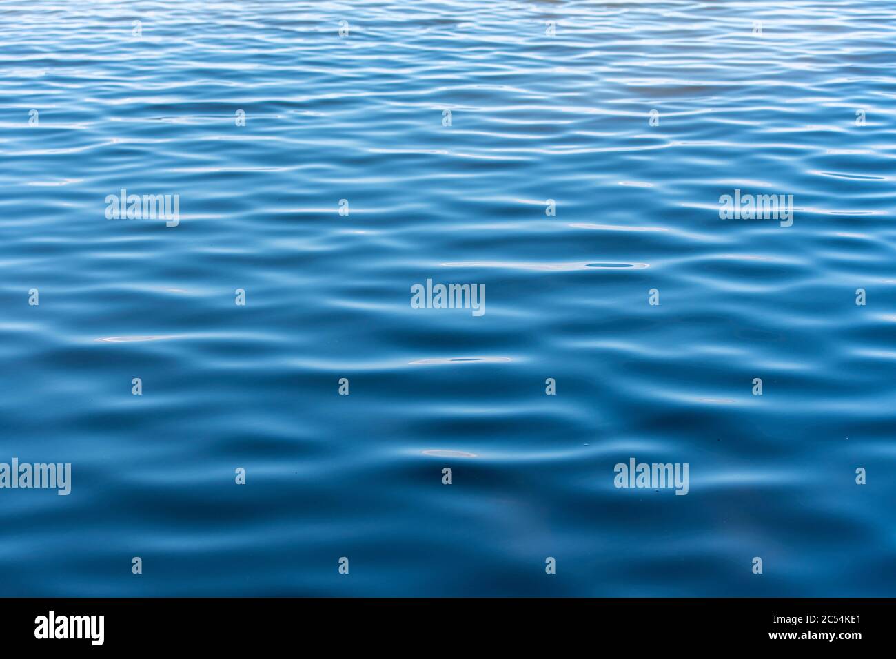 Water surface sea or ocean with sunlight as background Stock Photo - Alamy
