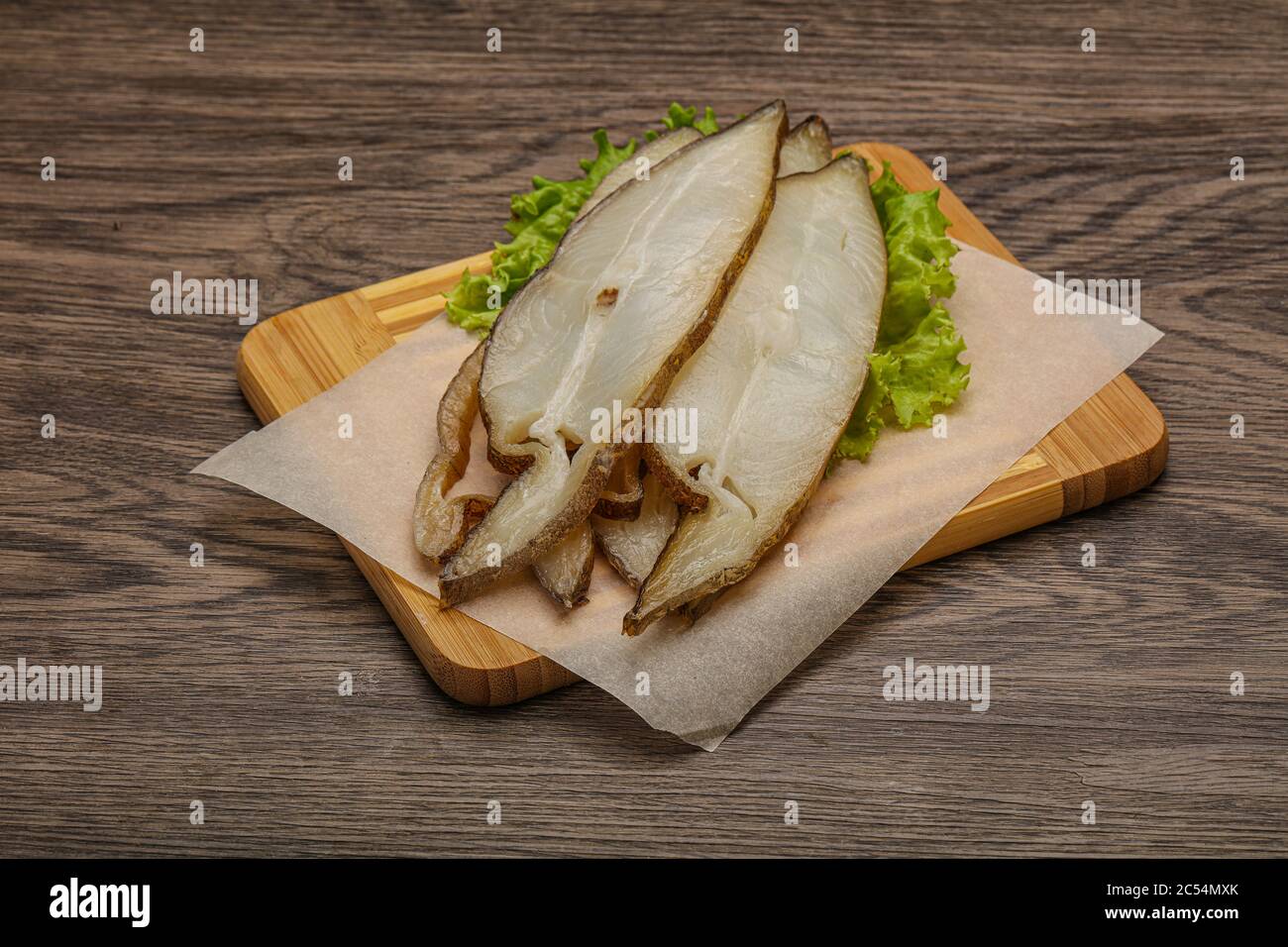 Delicous smoked halibut fish slices snack Stock Photo - Alamy