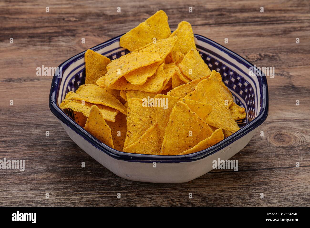 Mexican crunchy corn nachos triangle heap Stock Photo - Alamy