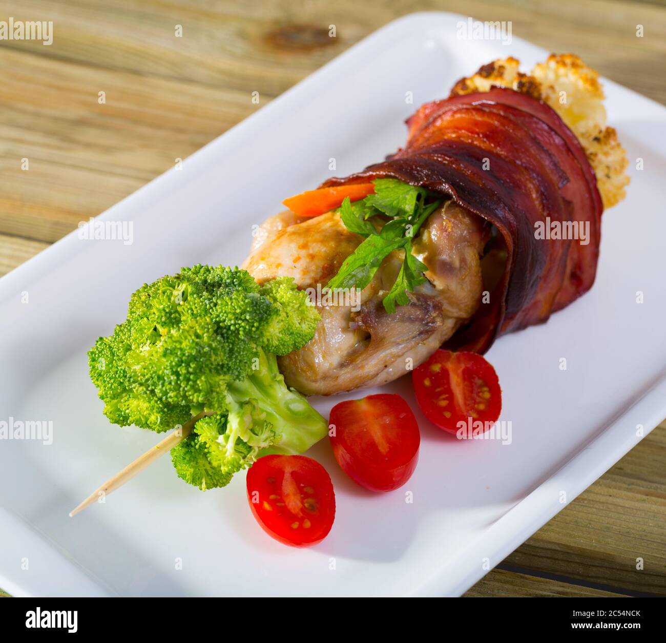Grilled quail with Iberian ham fried and served on skewers with ...