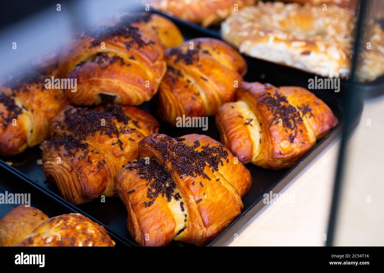 Image of fresh chocolate croissants, spanish dessert on counter in ...