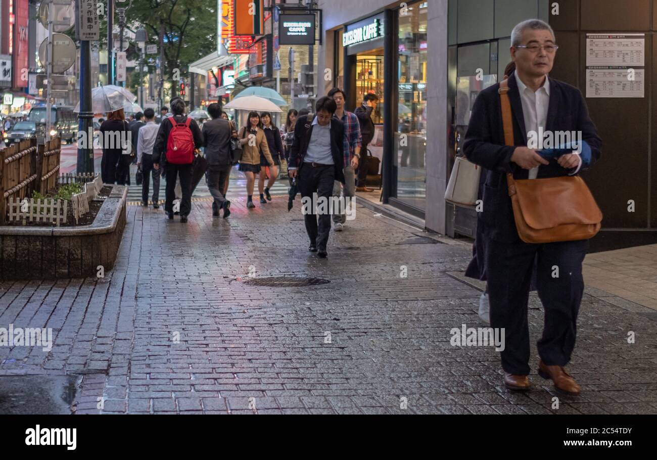 People walking in Dogenzakue street sidewalk in Shibuya, Tokyo, Japan ...