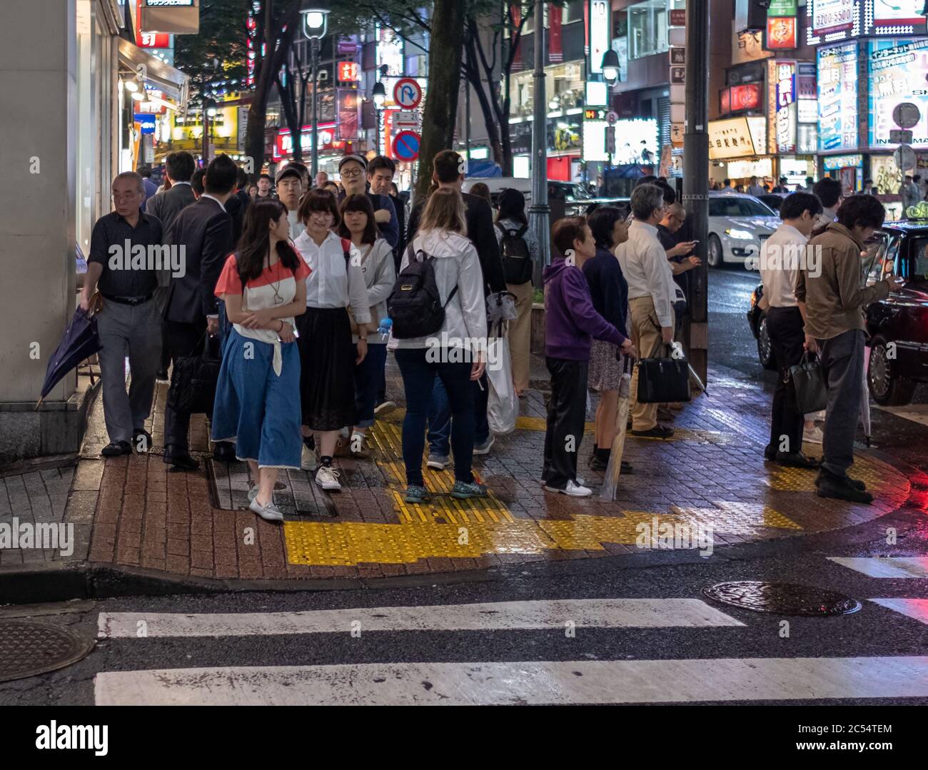 People walking in Dogenzakue street sidewalk in Shibuya, Tokyo, Japan ...