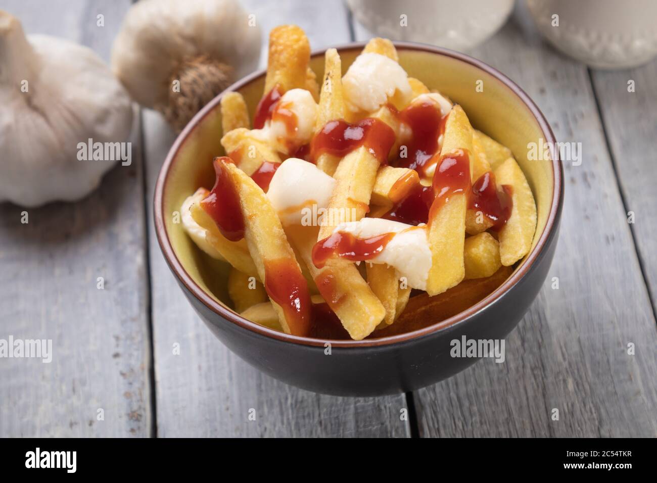 Canadian poutine, fried potato chips with cheese and gravy or sauce ...