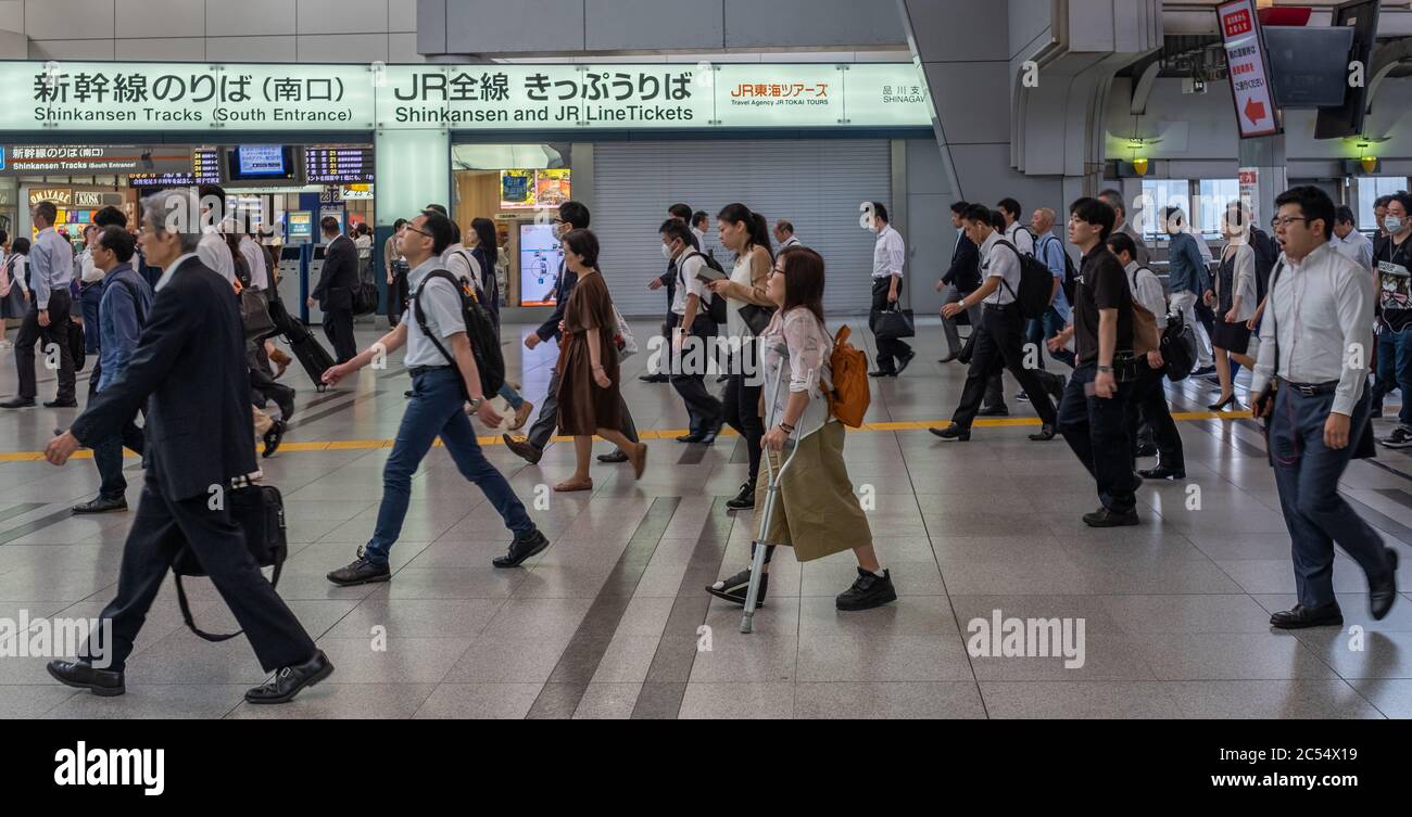Salaryman office worker commuters walking at Shinawaga Train Station ...
