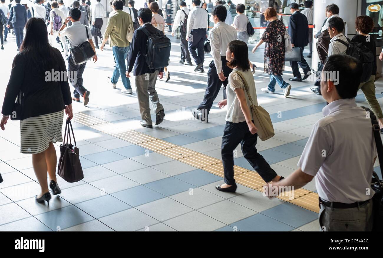 Salaryman office worker commuters walking at Shinawaga Train Station ...