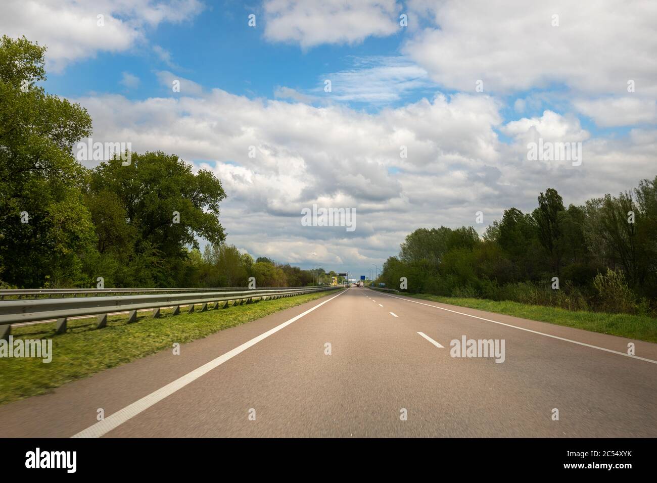 Emtpy suburaban highway car road with motion blurred fast speed driving ...