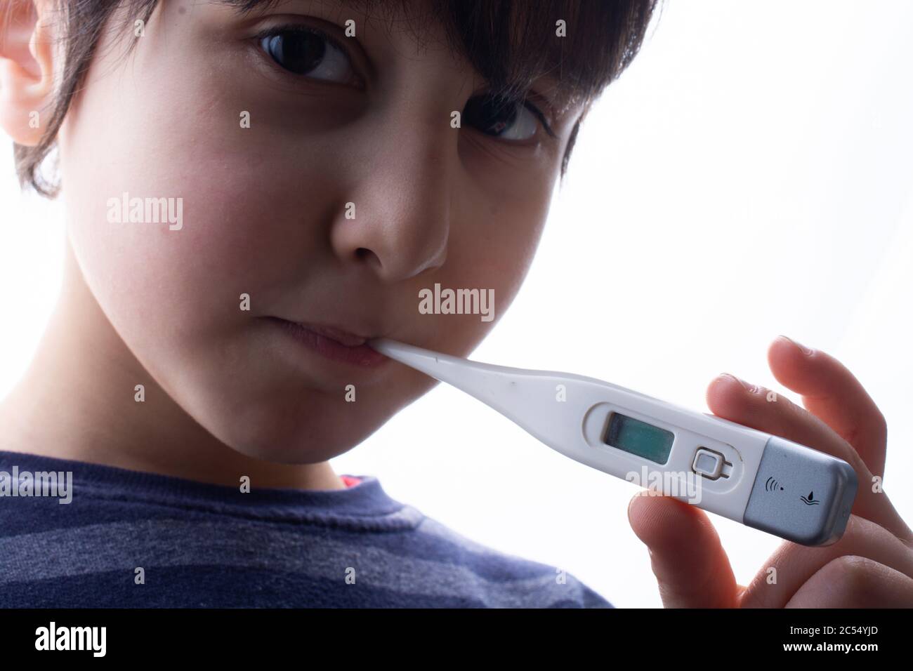 measuring Fever temperature. Child with thermometer. World pandemic ...