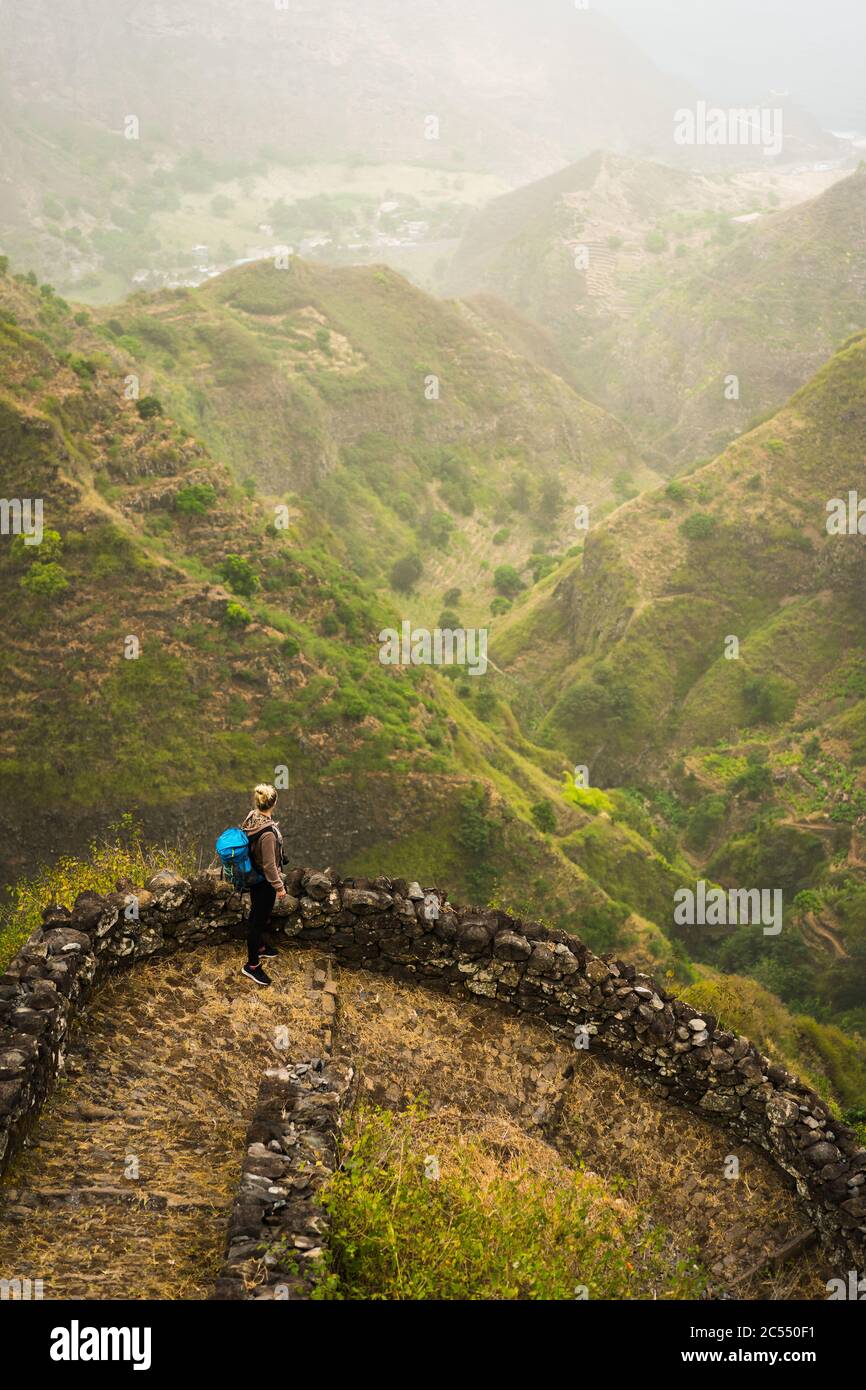 Female tourist looking down the Paul valley with gorgeous panorama view ...
