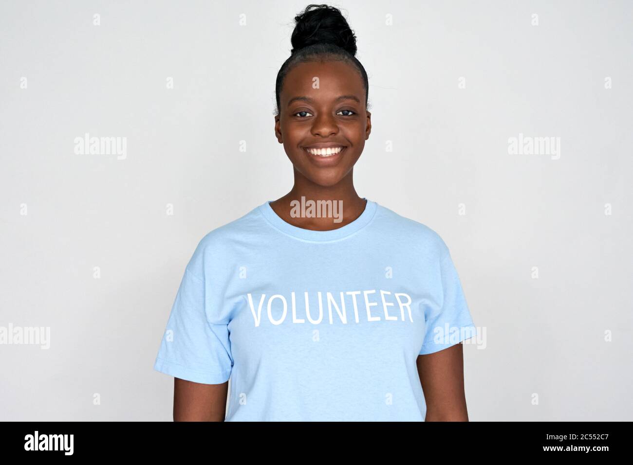 Happy african woman activist wear volunteer tshirt isolated on grey ...
