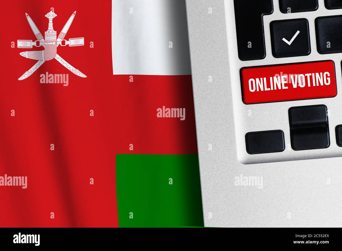 Online voting concept in Sultanate of Oman. Keyboard near country flag ...