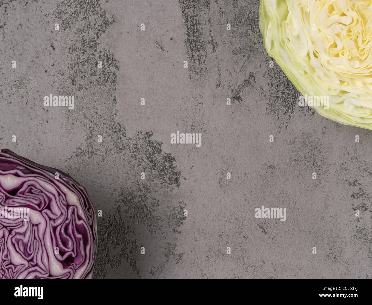 Organic white cabbage and red cabbage in cross section. The gray ...