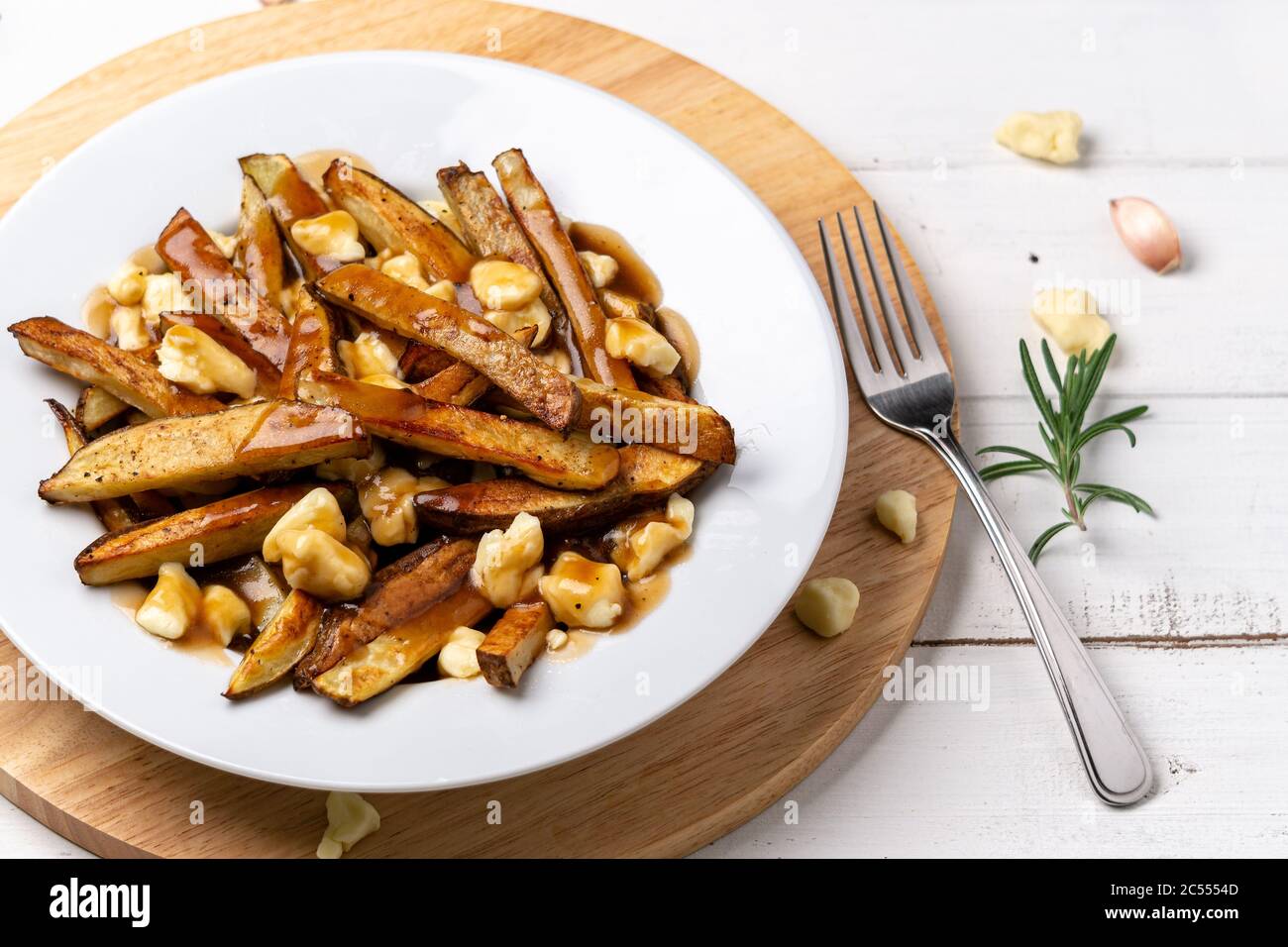 Poutine comfort food closeup. A classic fast food cuisine dish from ...