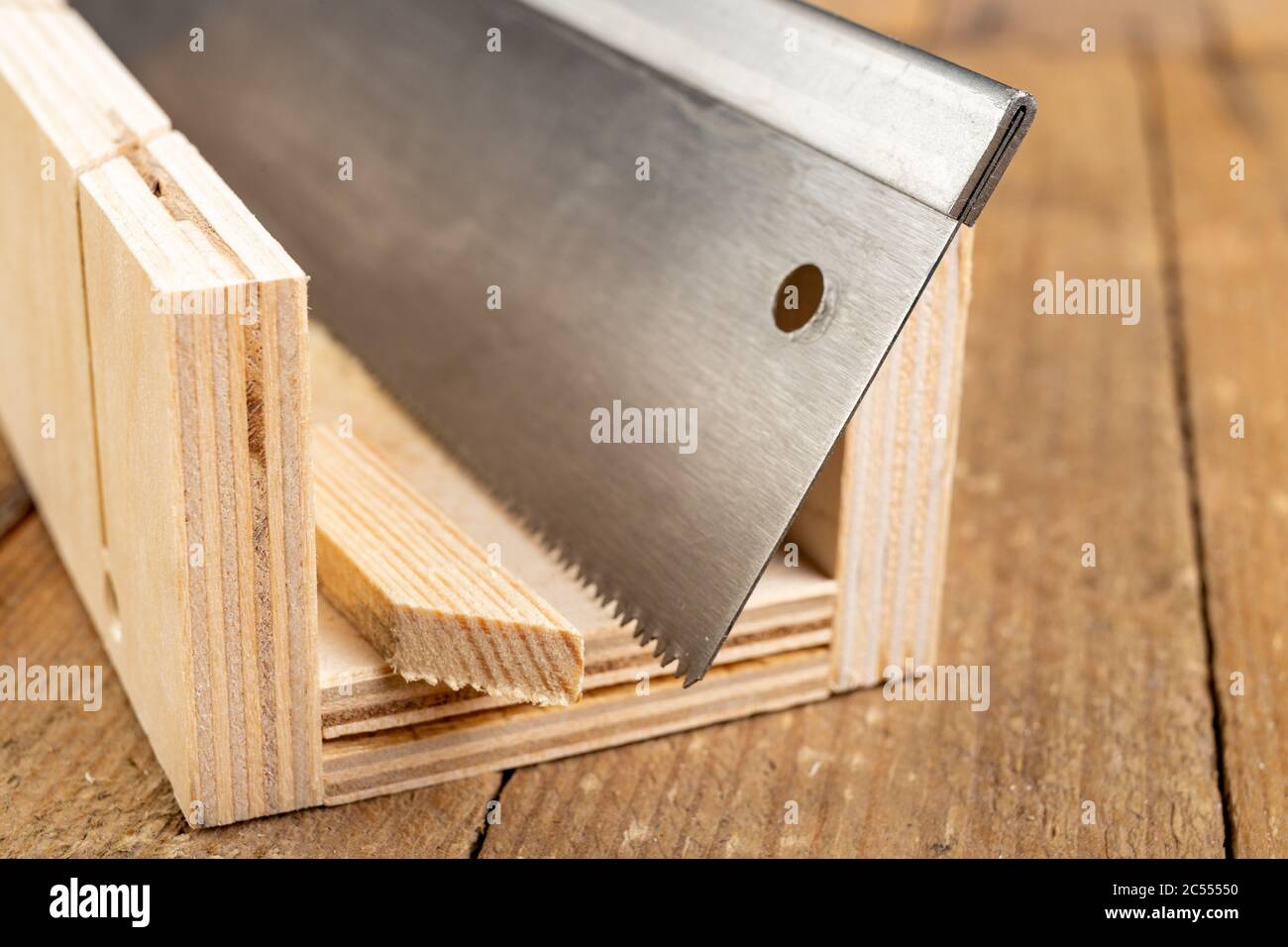 Cutting wooden slats at an angle. Small works in the carpentry shop ...