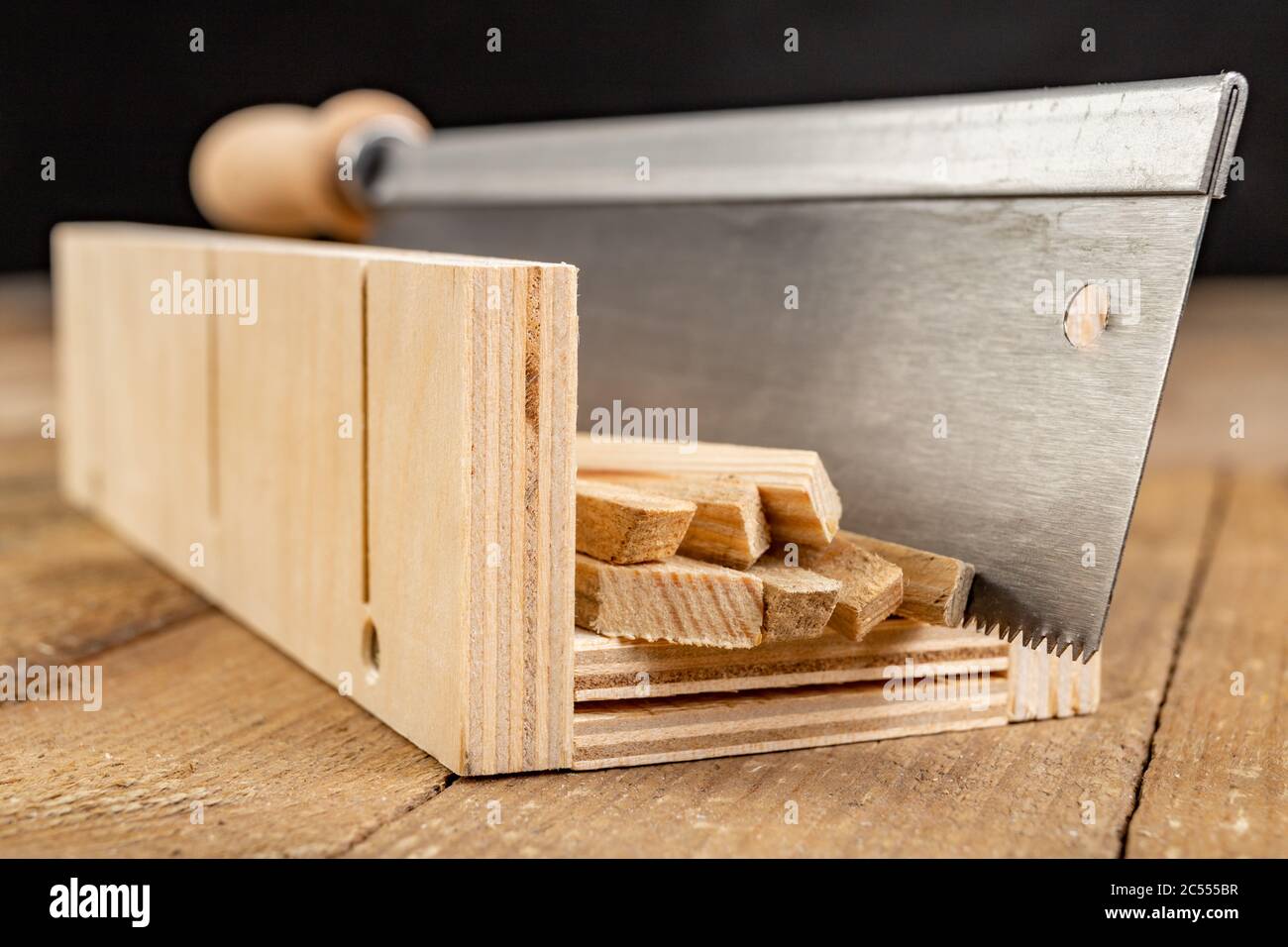 Cutting wooden slats at an angle. Small works in the carpentry shop ...