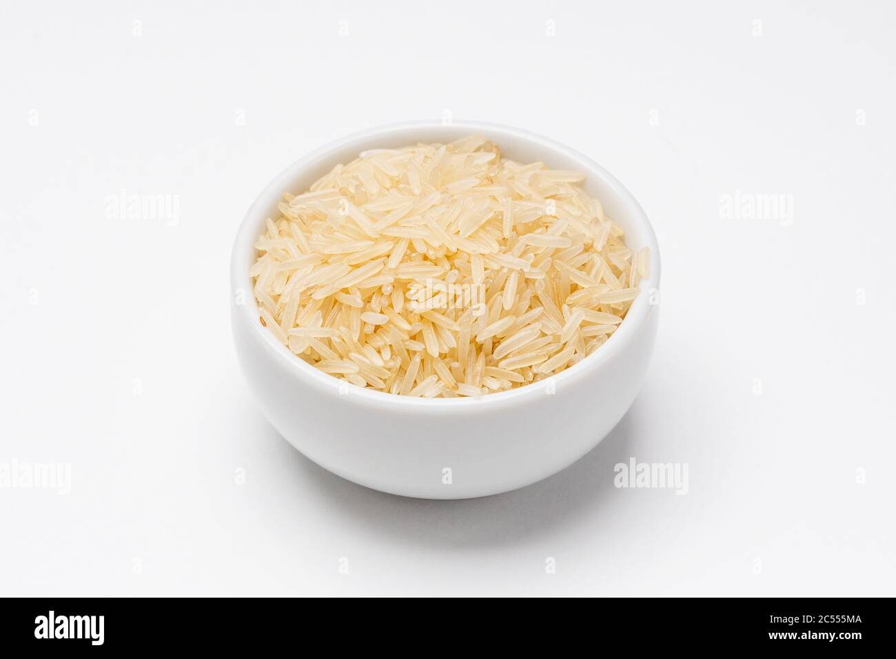 Basmati rice bowl on white background. Rice comes from seeds of grass ...