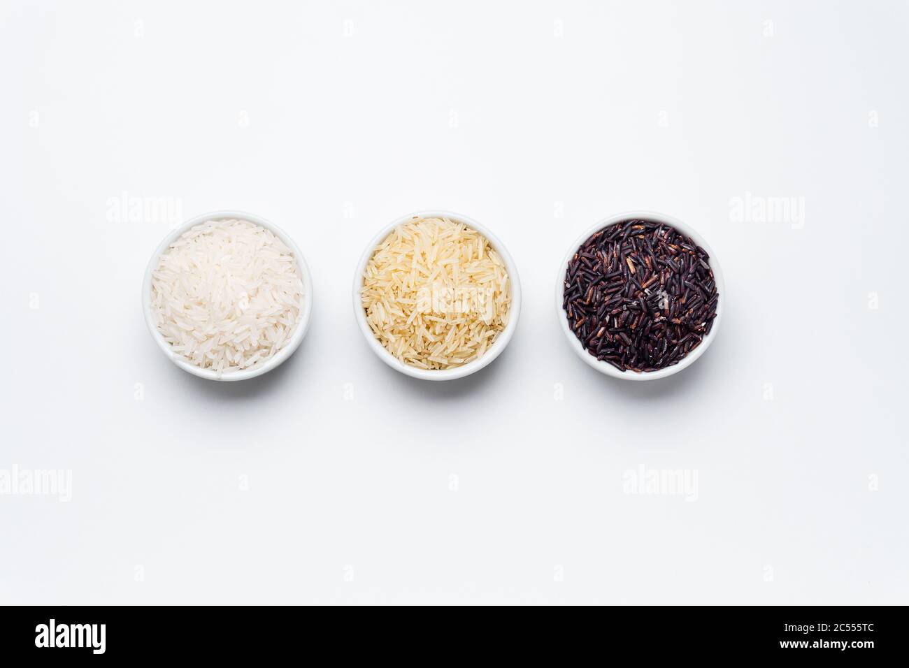 Rice bowls top view white background. 3 varieties of rice, white jasmin ...