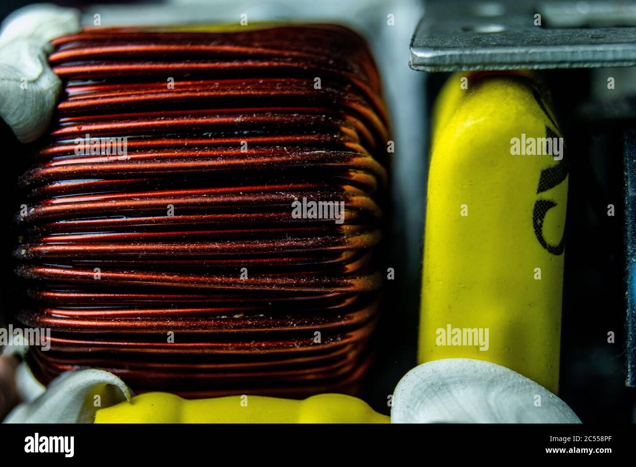Closeup of the inductor of a computer under the lights with a blurry ...