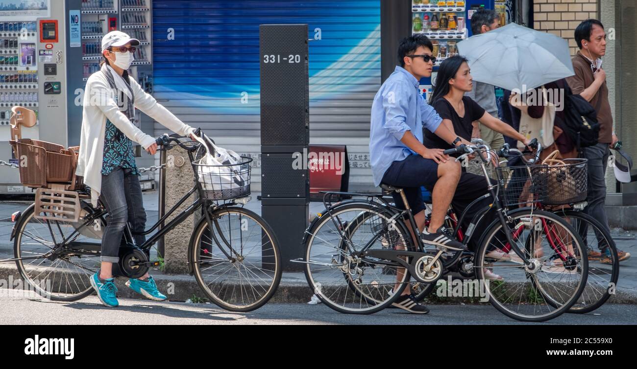 People riding bicycle at Shibuya street, Tokyo, Japan Stock Photo - Alamy