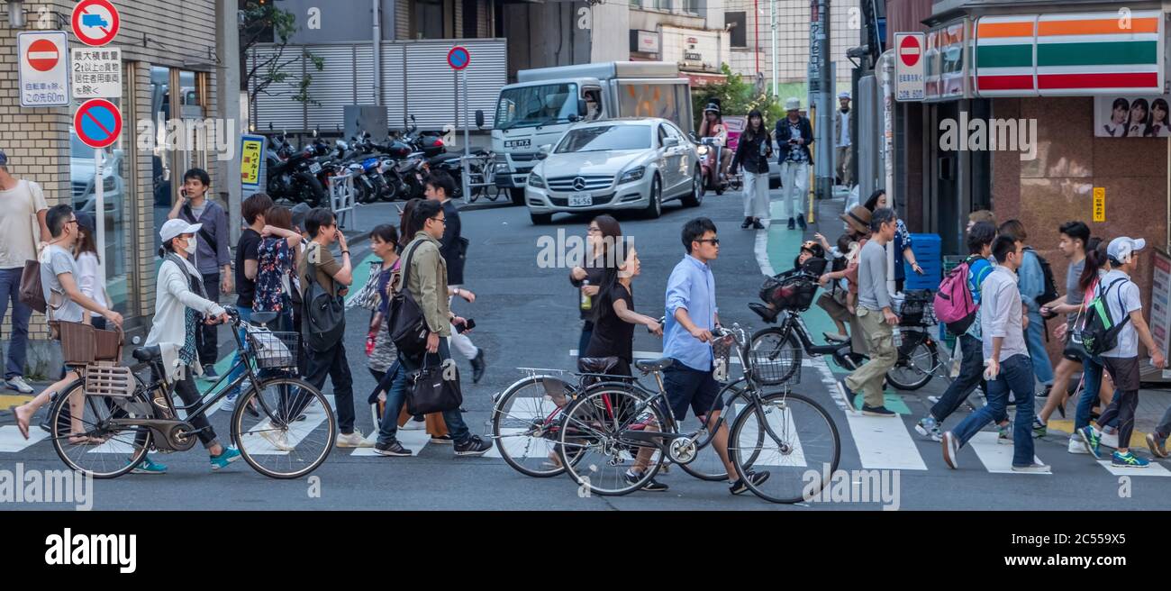 People riding bicycle at Shibuya street, Tokyo, Japan Stock Photo - Alamy