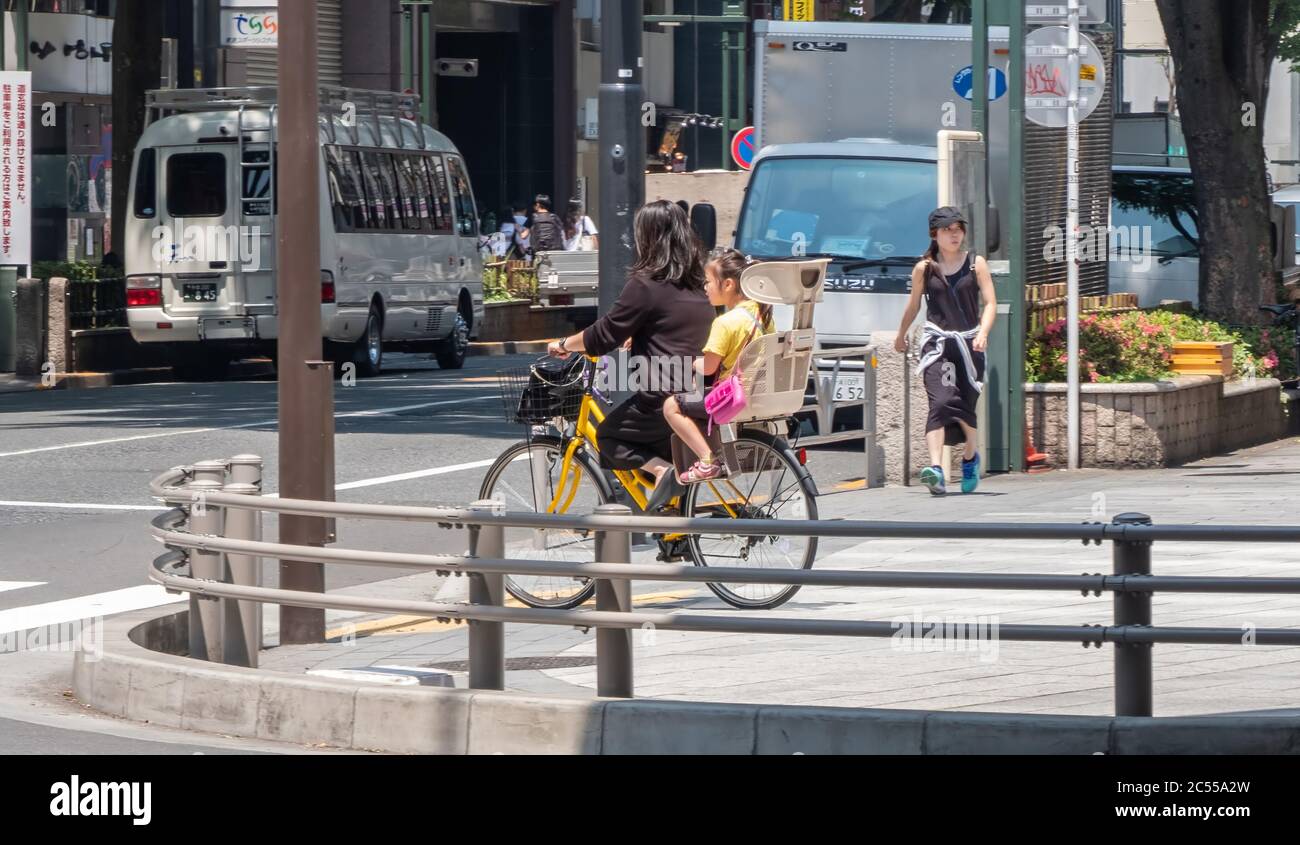 People riding bicycle at Shibuya street, Tokyo, Japan Stock Photo - Alamy