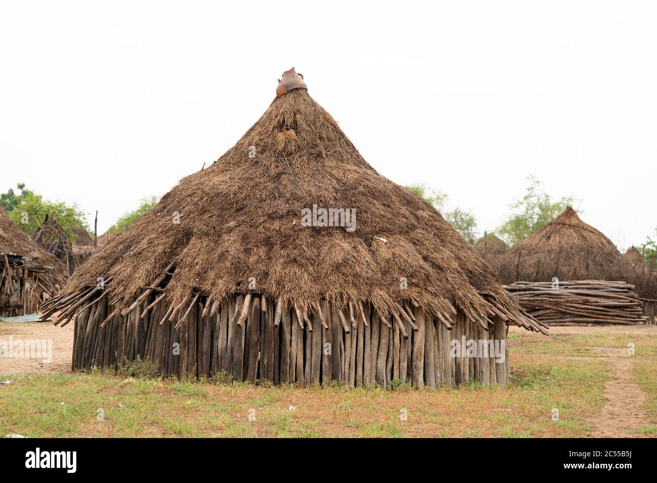 A typical straw-thatched tribal hut in an indigenous, ethnic Karo tribe ...
