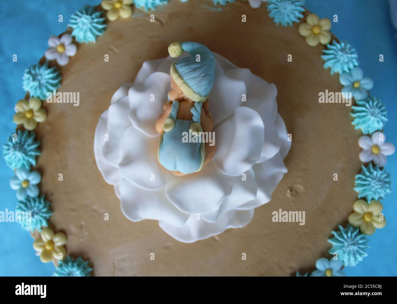 Top view of a cake with a baby decoration on it Stock Photo - Alamy
